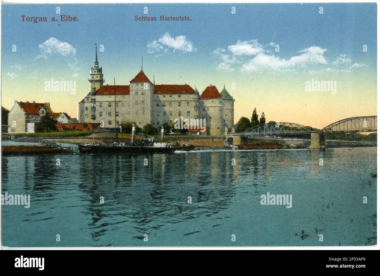 Castle Hartenfels, Bridge, Elbe with tractor Torgau. Castle Hartenfels ...