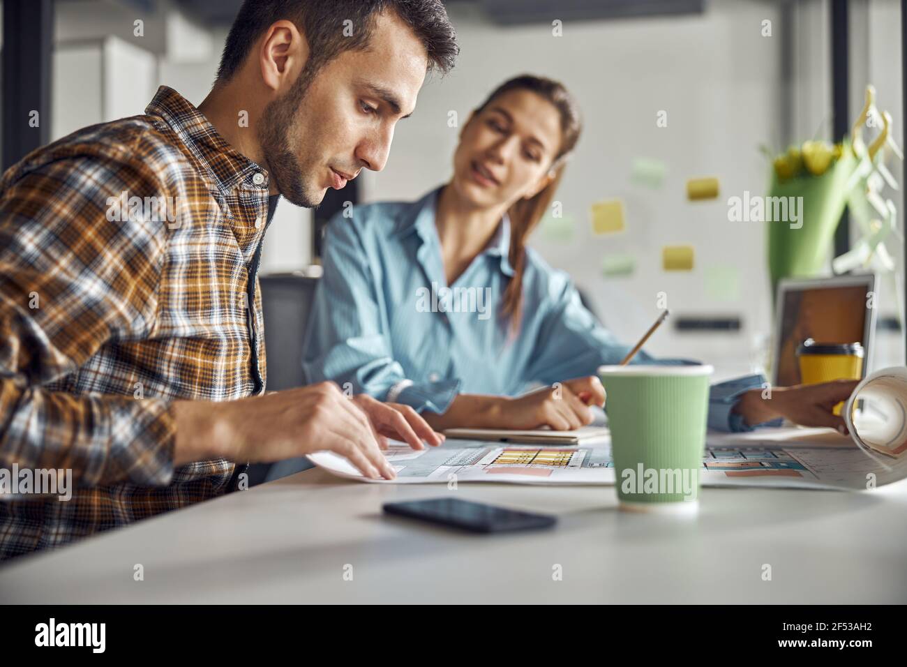Two young architects working at a new building project Stock Photo - Alamy
