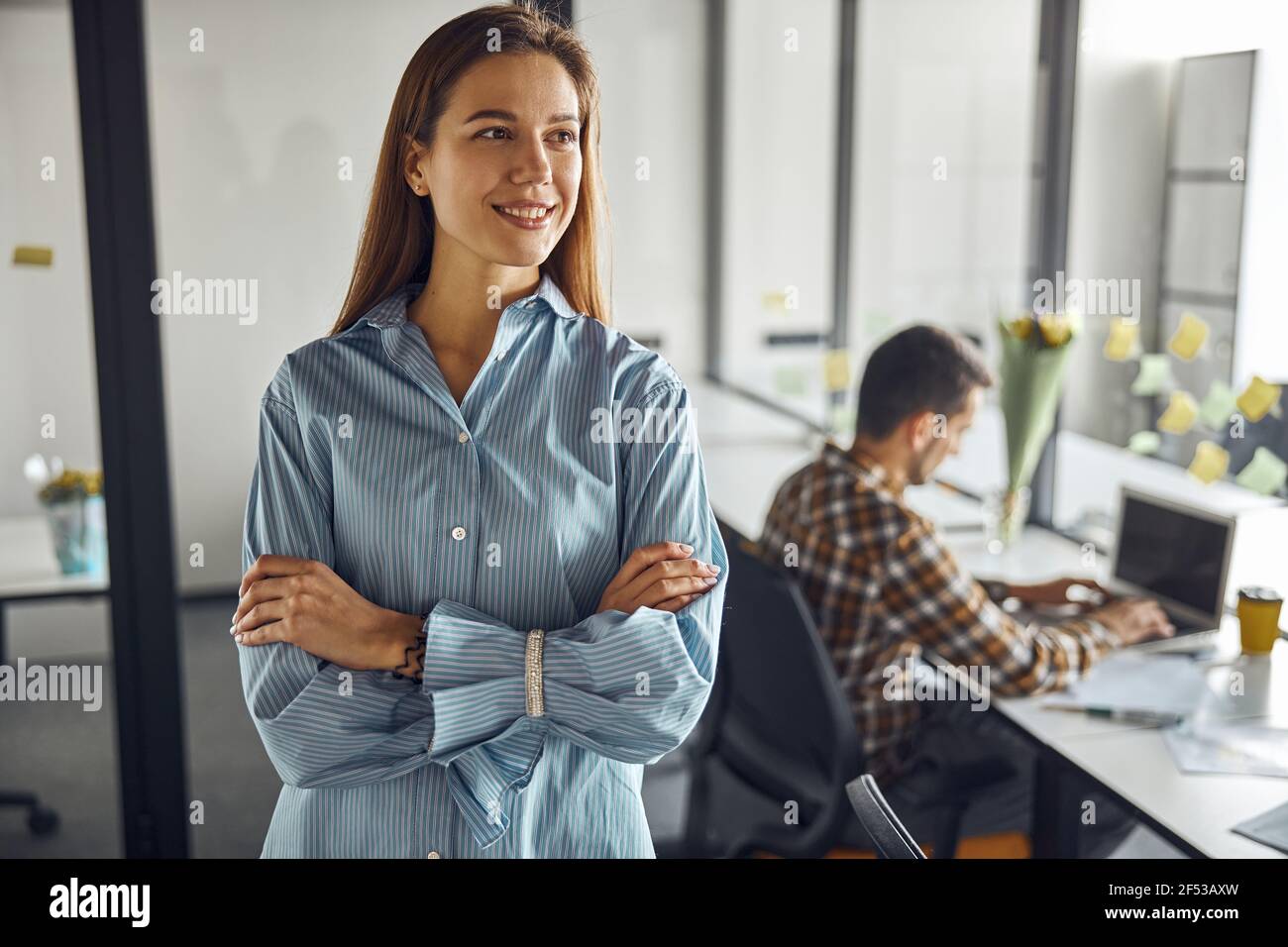 Pleased good-looking woman employee daydreaming in the workplace Stock ...