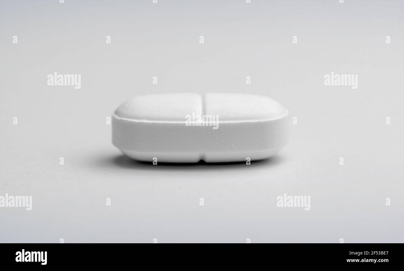 Macro photography of an Oval white tablet that can be divided Stock ...