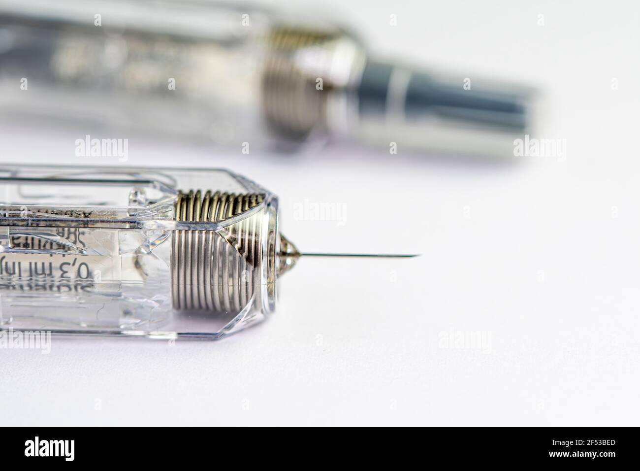 Macro photography of an pre-filled syringe with an automatic safety ...