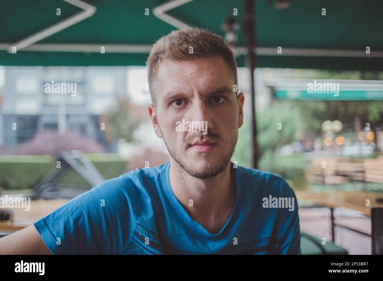 Shallow focus shot of a Bosnian Caucasian man looking at the camera ...