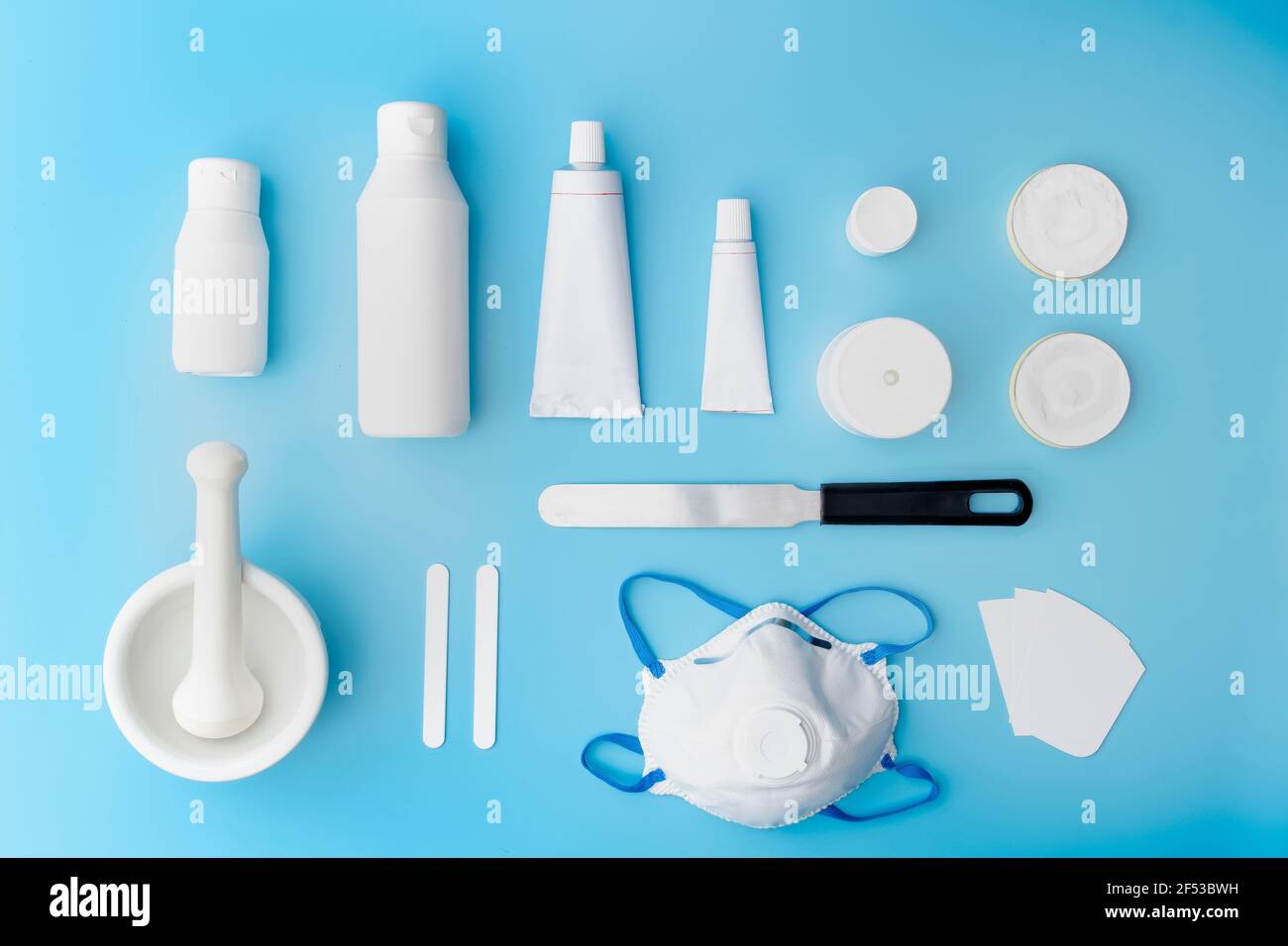 Pharmaceutical lab equipment ,flat or top view on white and blue table ...