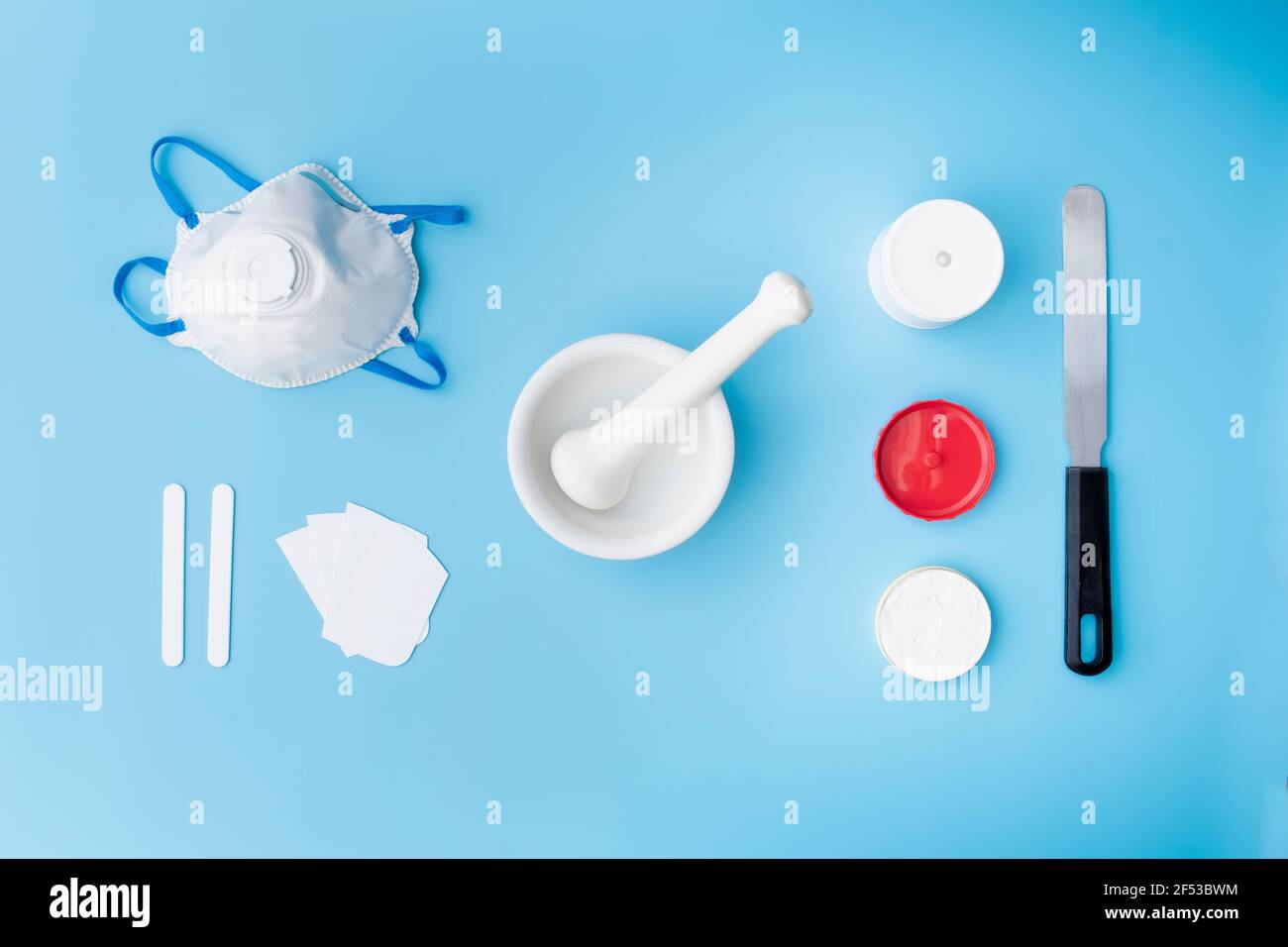 Pharmaceutical lab equipment ,flat or top view on white and blue table ...