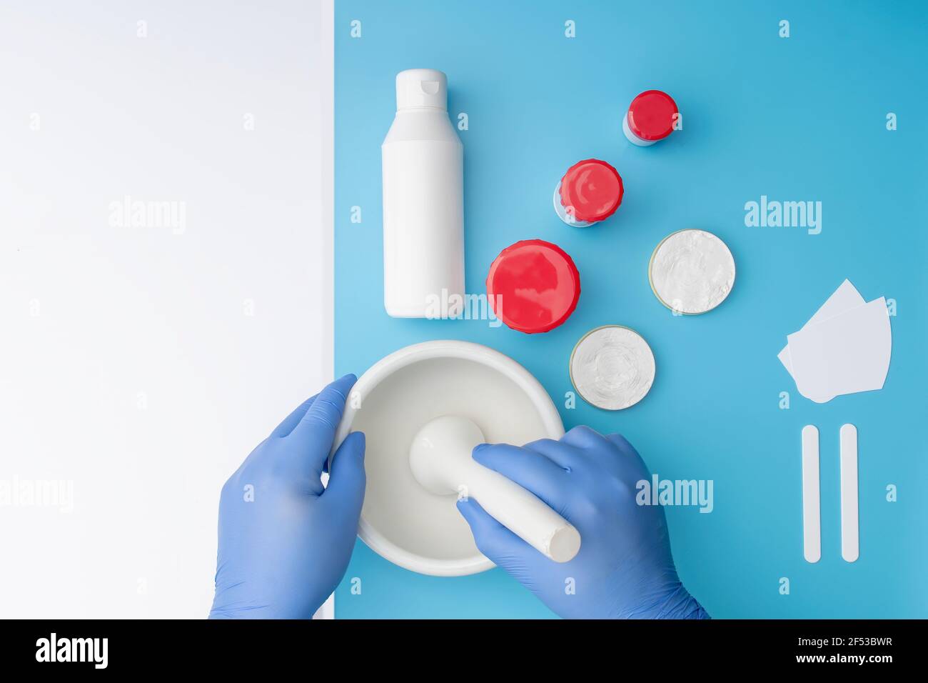 Pharmaceutical lab equipment ,flat or top view on white and blue table ...