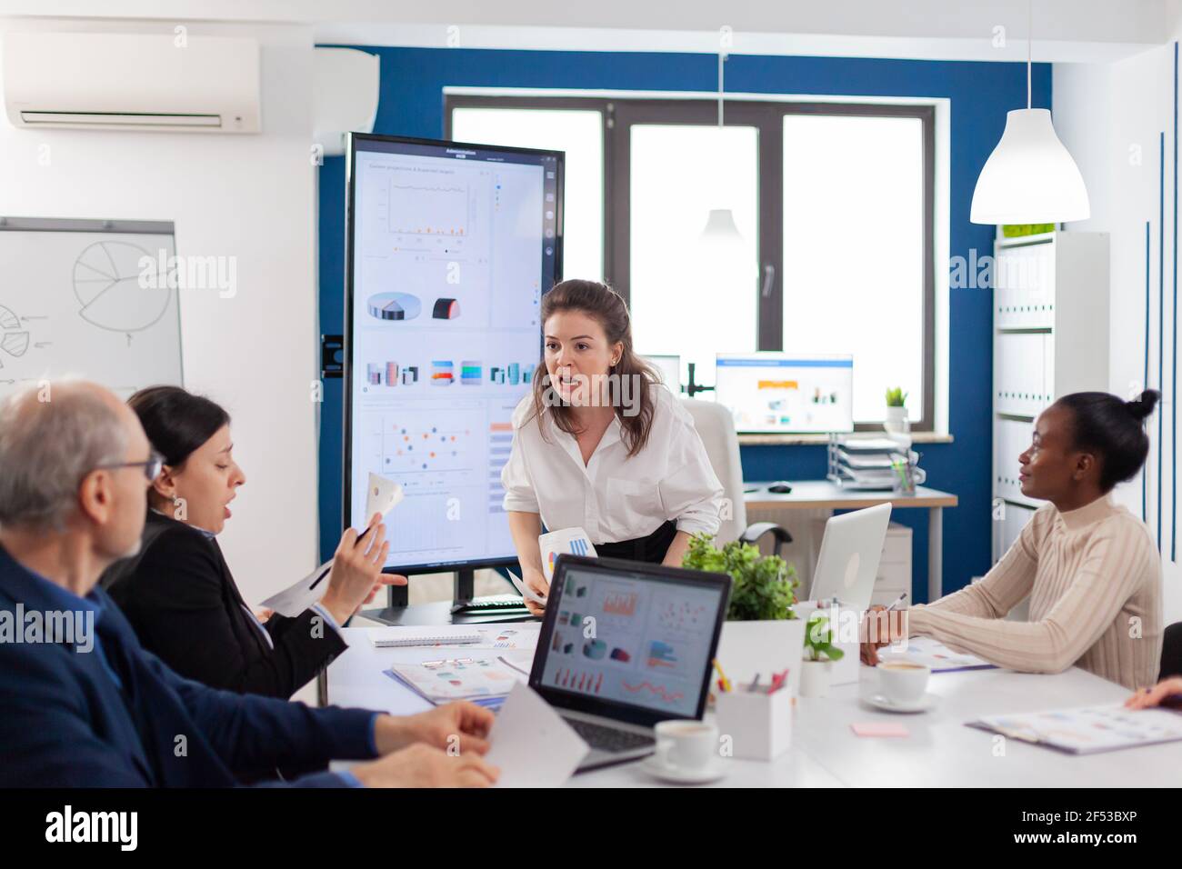 Company boss screaming at senior employee during meeting with in ...