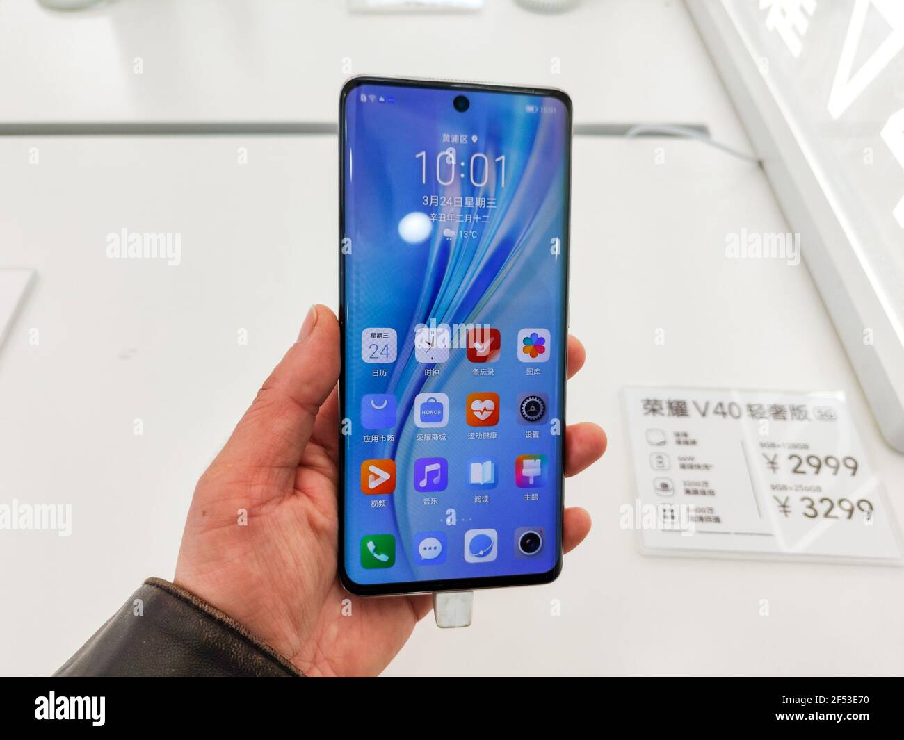 SHANGHAI, CHINA - MARCH 24, 2021 - A consumer displays a Honor V40 ...