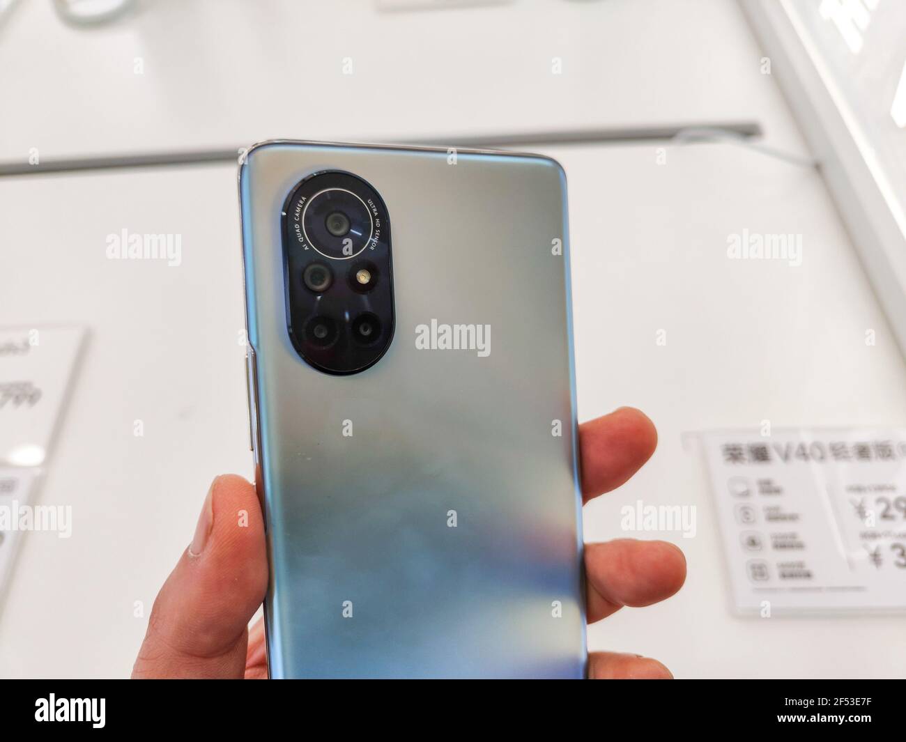 SHANGHAI, CHINA - MARCH 24, 2021 - A consumer displays a Honor V40 ...