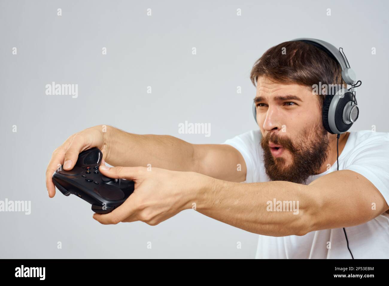 Excited guy holding joystick hi-res stock photography and images - Alamy
