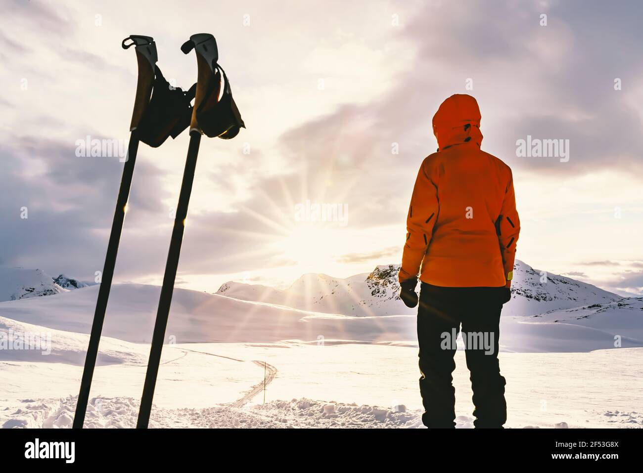 Female mountaineer and explorer enjoying a witner sunset Stock Photo ...