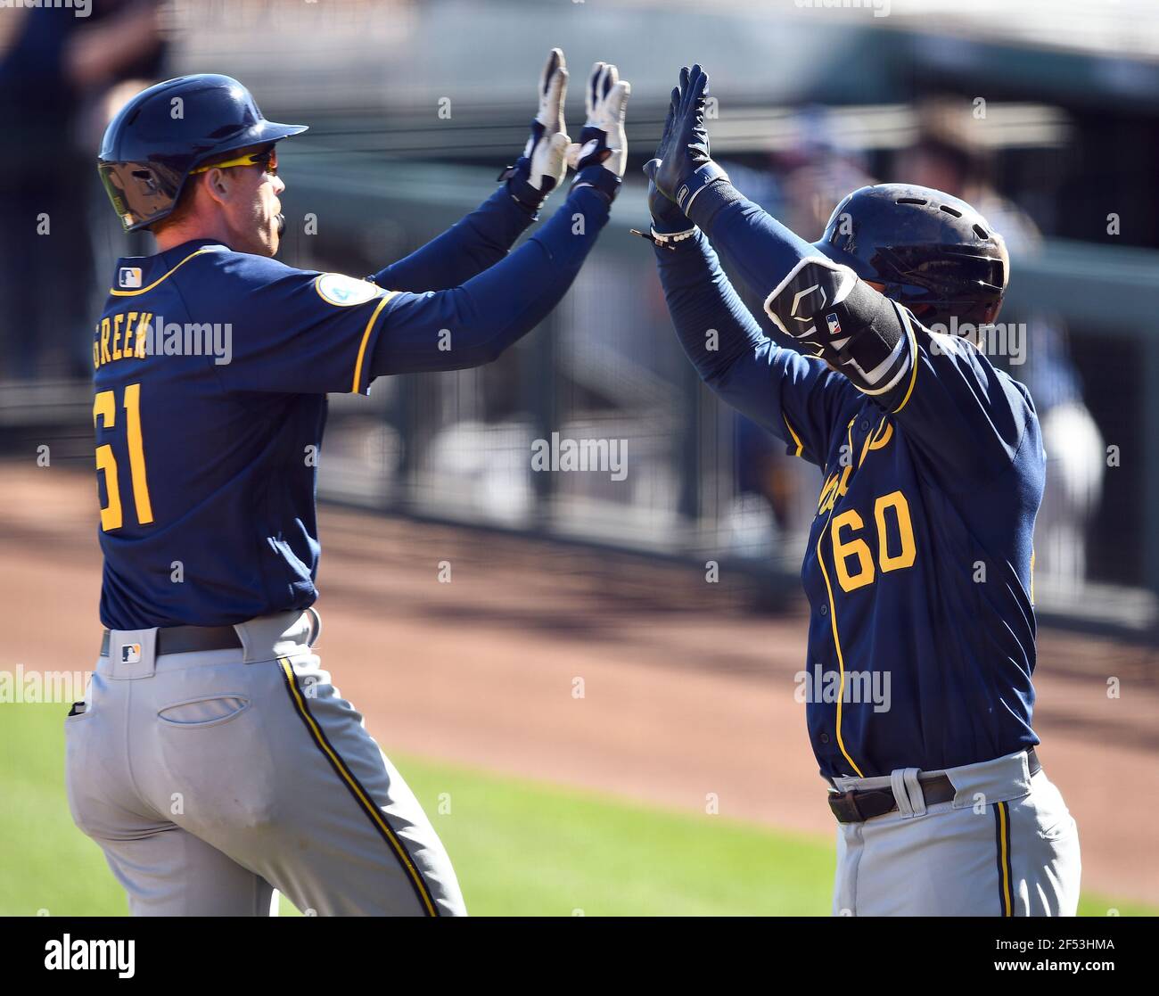 Zach Green (left) gets a hit ten from teammate Dustin Peterson during a ...