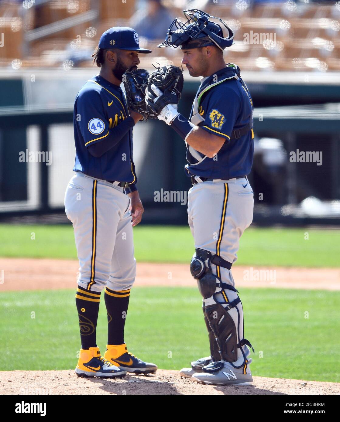 Leo Crawfors (left) and Luke Maile (right) of the Milwaukee Brewers ...