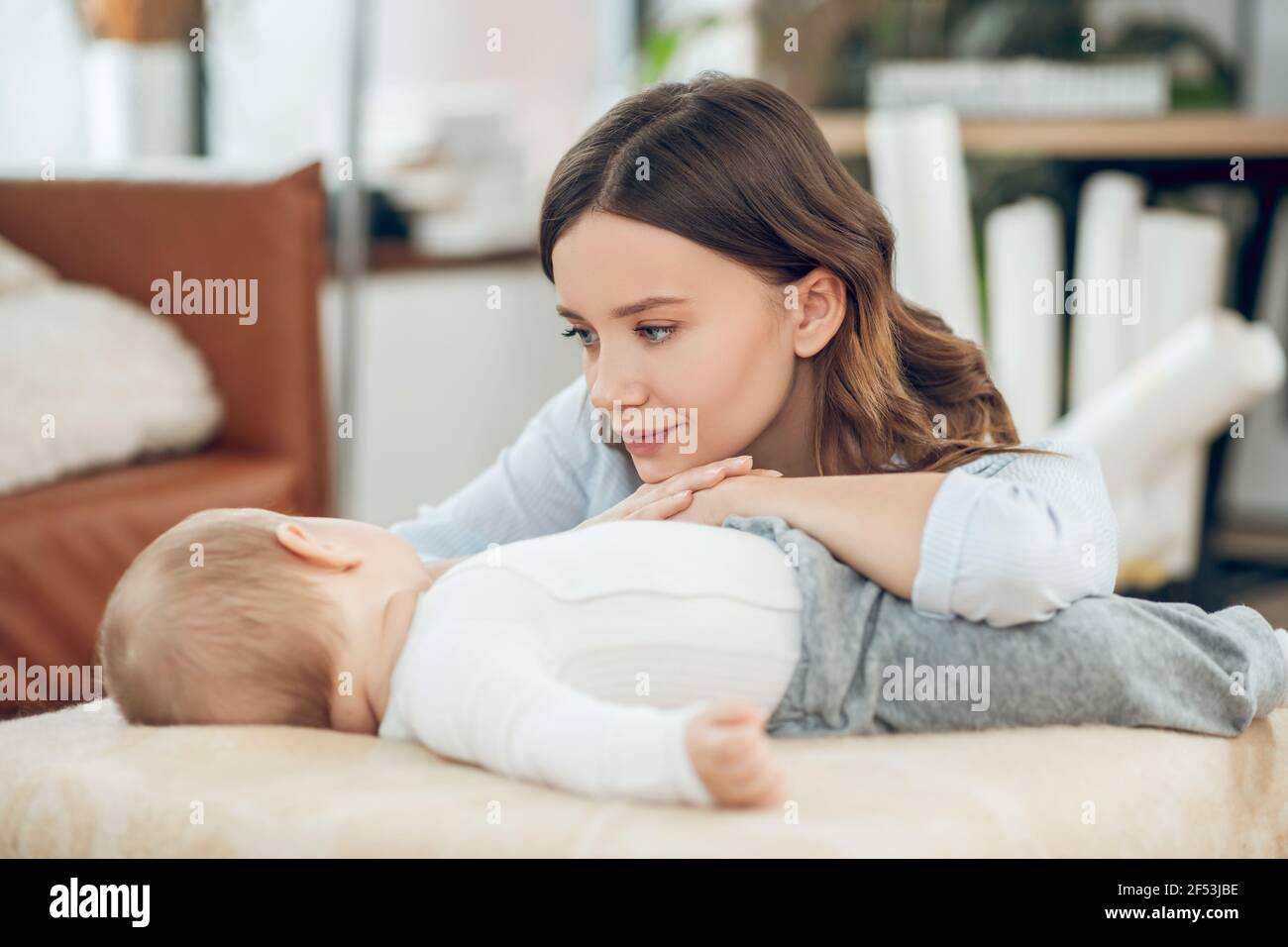 Attentive mother watching sleeping little child Stock Photo - Alamy
