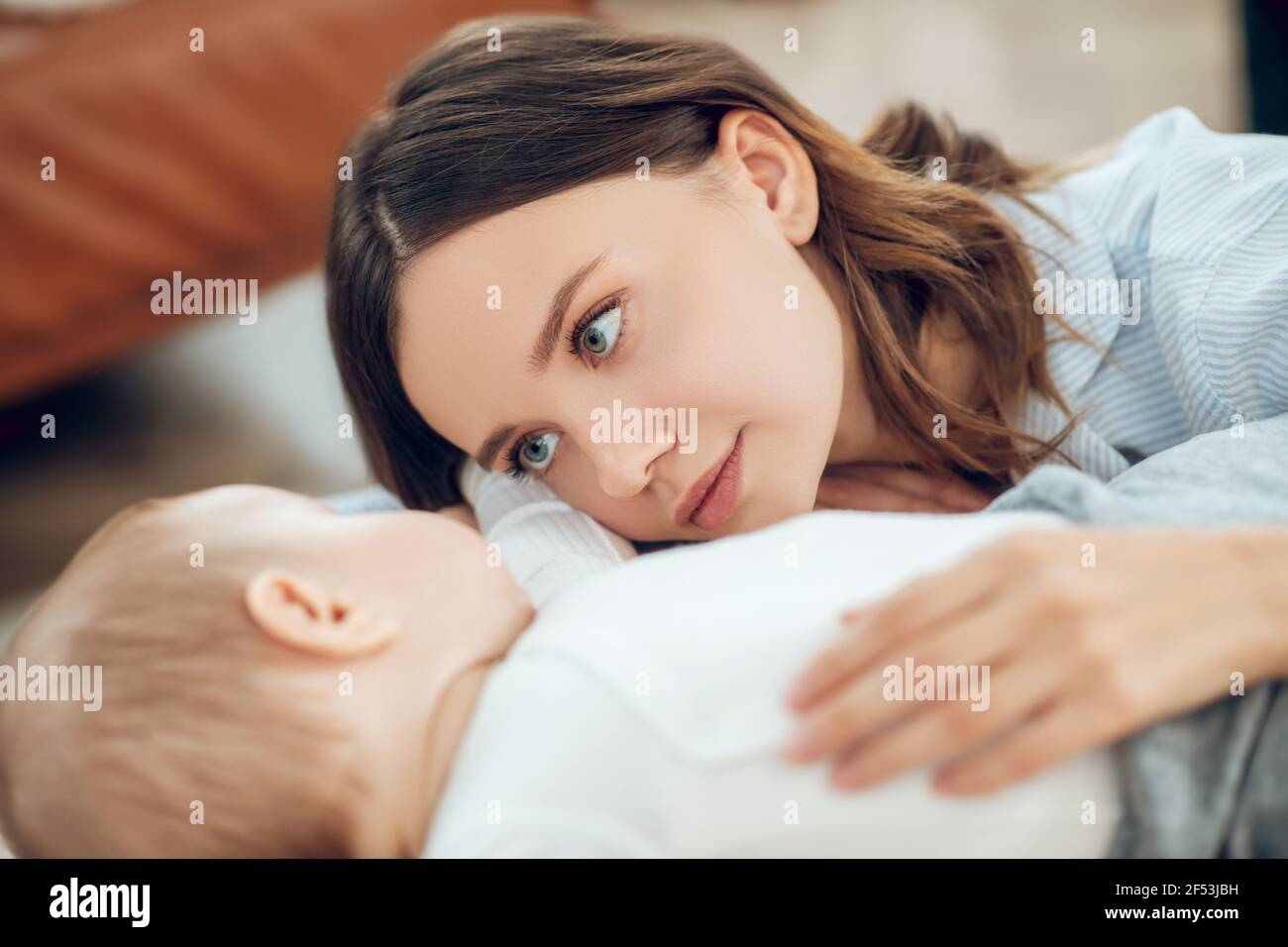 Baby touching face hi-res stock photography and images - Alamy