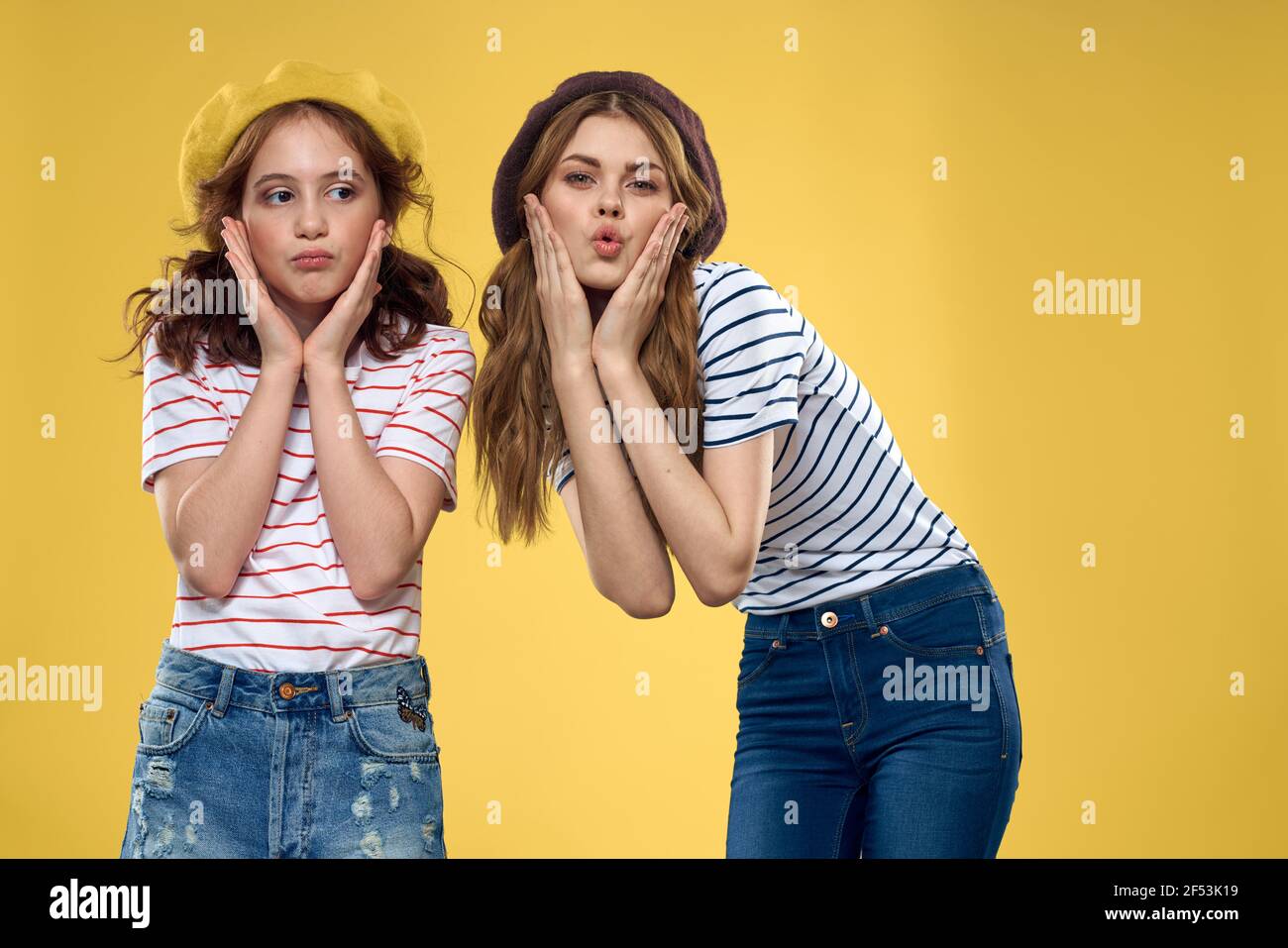 funny mom and daughter wearing hats fashion fun joy family yellow ...