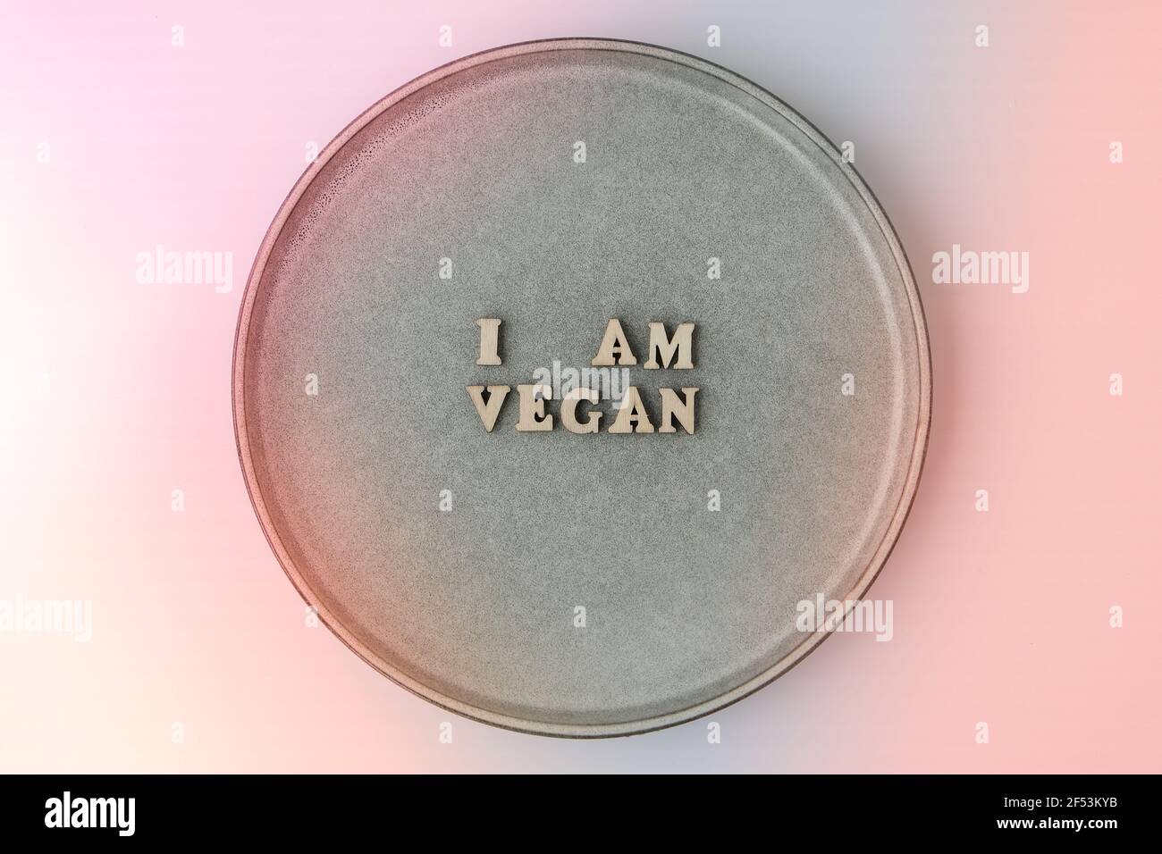 I AM VEGAN text in plate. Veganism, vegetarian healthy lifestyle ...