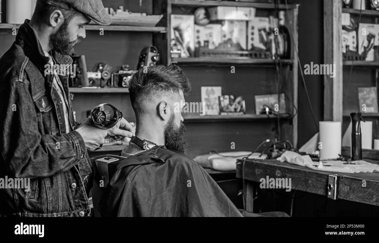 Barbershop concept. Hipster bearded client got hairstyle. Barber with ...