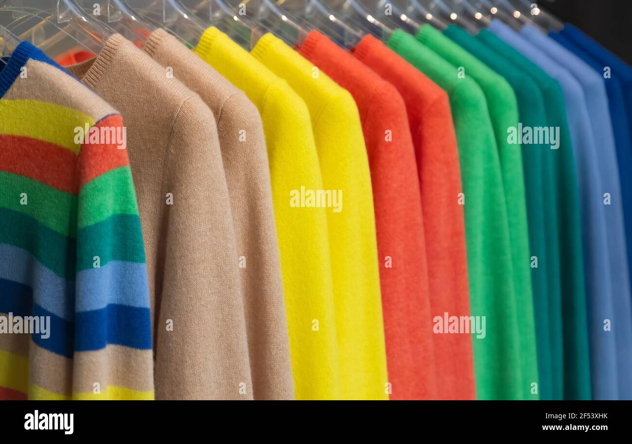 Multi Colored Sweaters In Rack Of Sale Stock Photo - Alamy