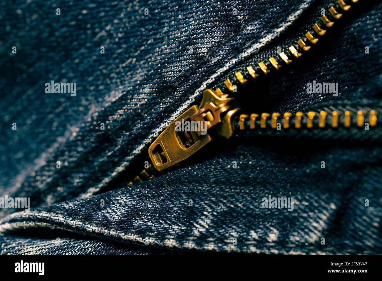 Denim pant zipper with Thick yellow thread Stock Photo - Alamy