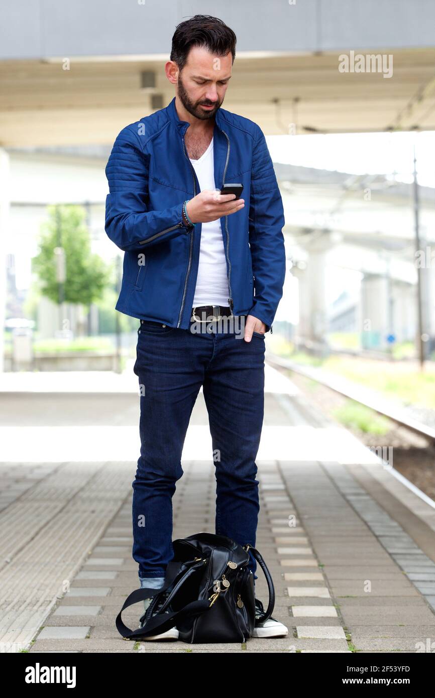Man standing train station hi-res stock photography and images - Alamy