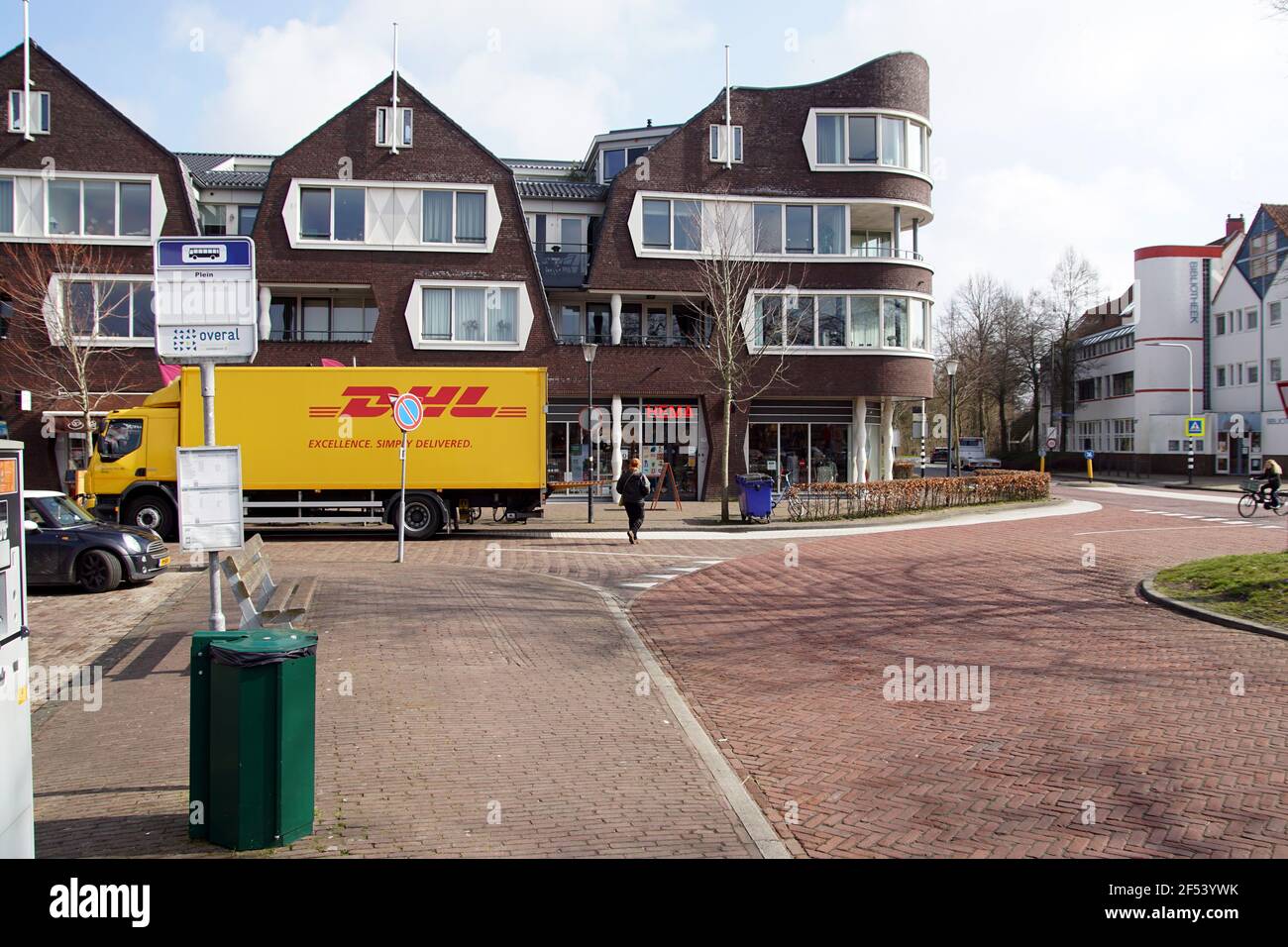 Dutch department store De Hema and a yellow truck from the transport ...