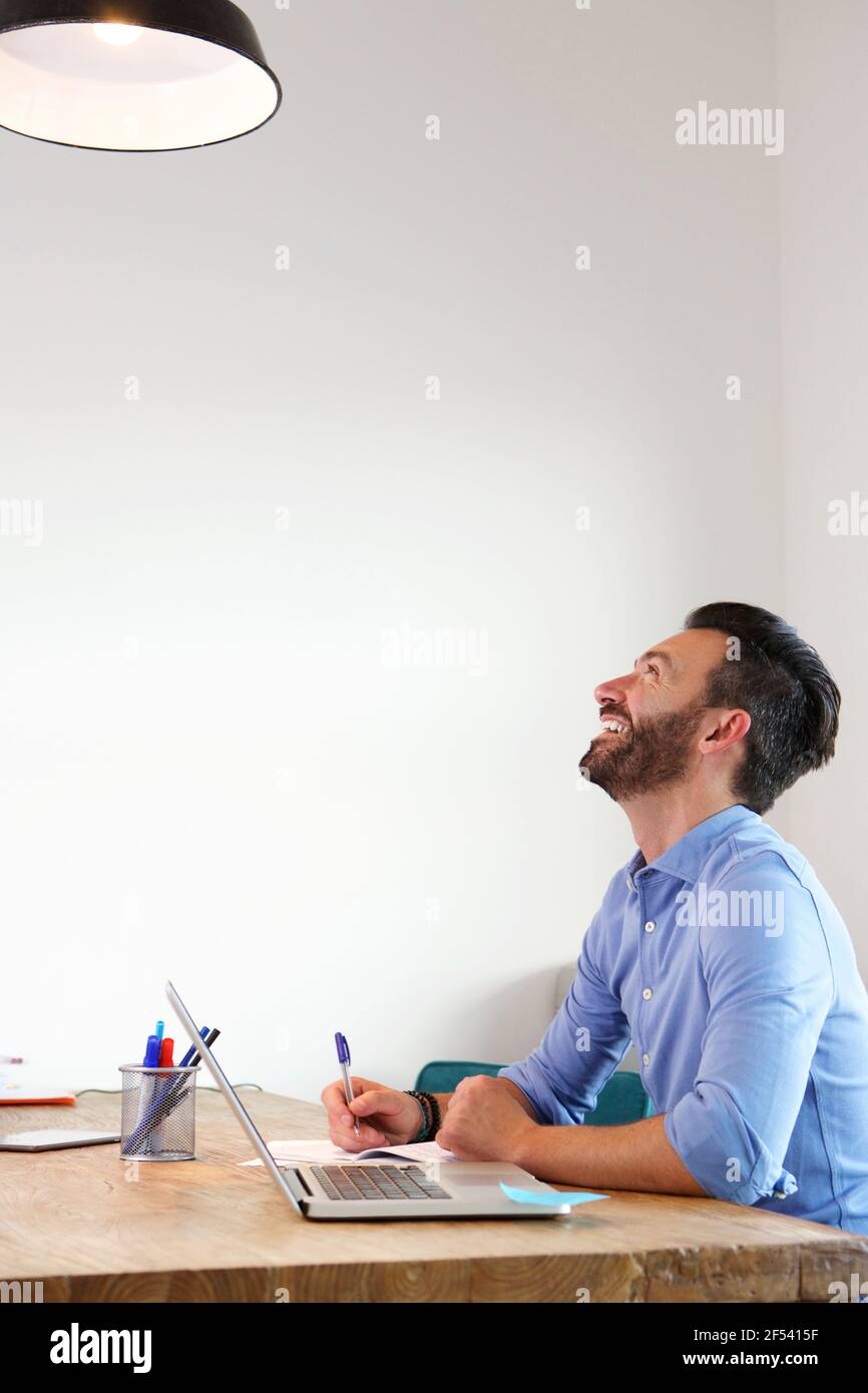 Side view guy sitting computer hi-res stock photography and images - Alamy