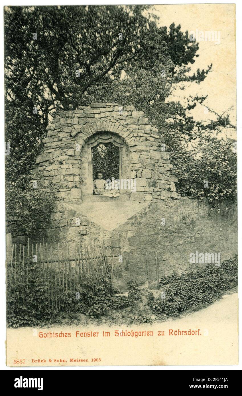 Gothic window of the ruin in the castle garden Röhrsdorf. Gothic window ...