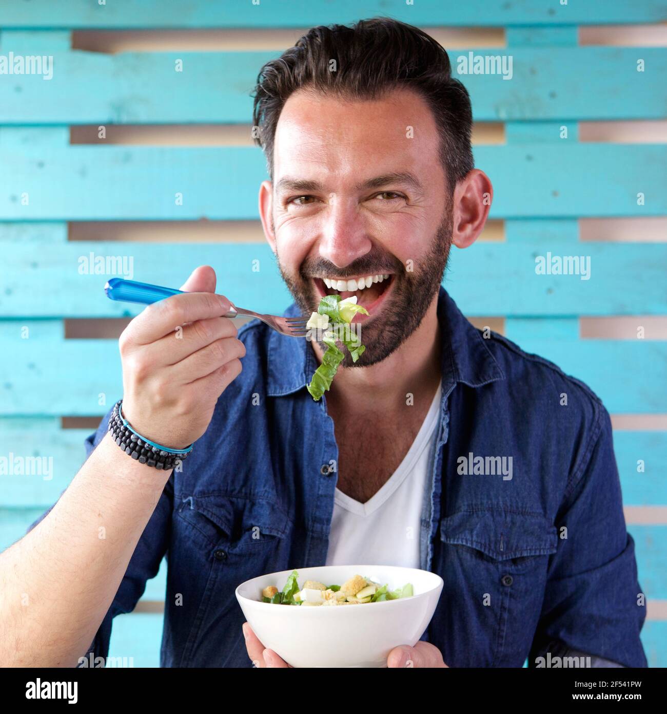 Man eating salad handsome hi-res stock photography and images - Alamy
