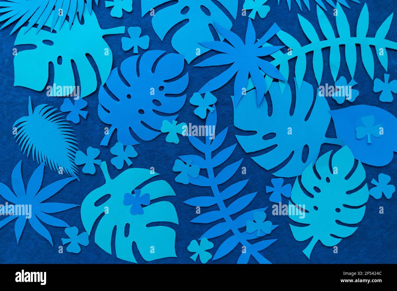 Creative background of tropical leaves on a green backdrop. View from ...