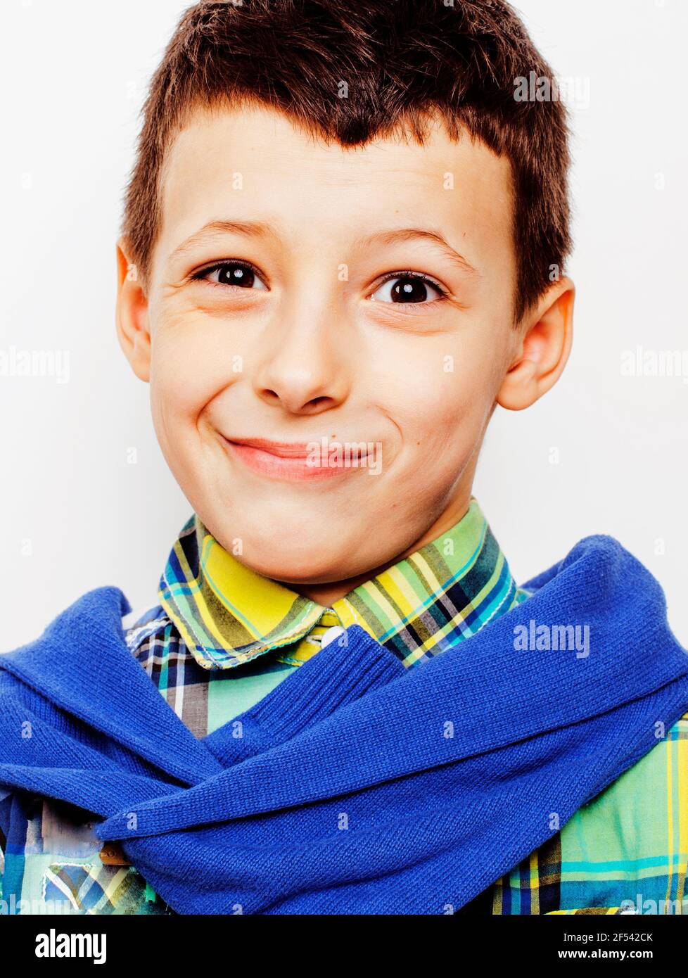 little cute boy on white background gesture tumbs up smiling closeup ...