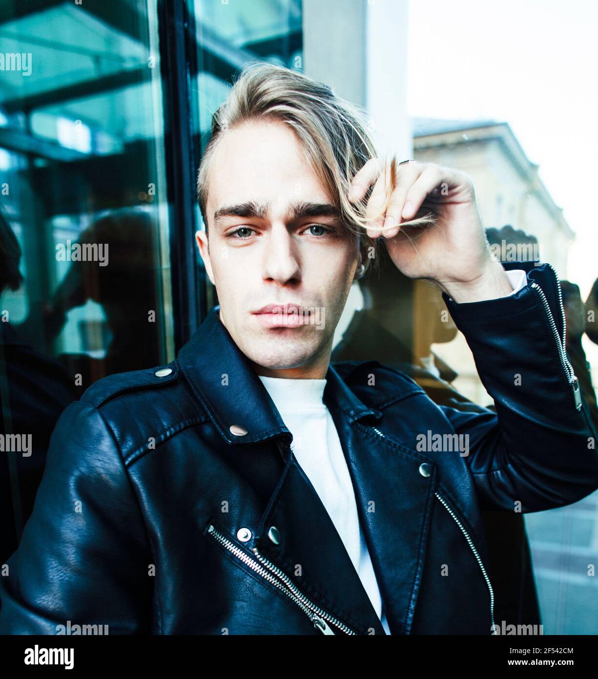 young modern hipster guy at new building university blond fashion ...