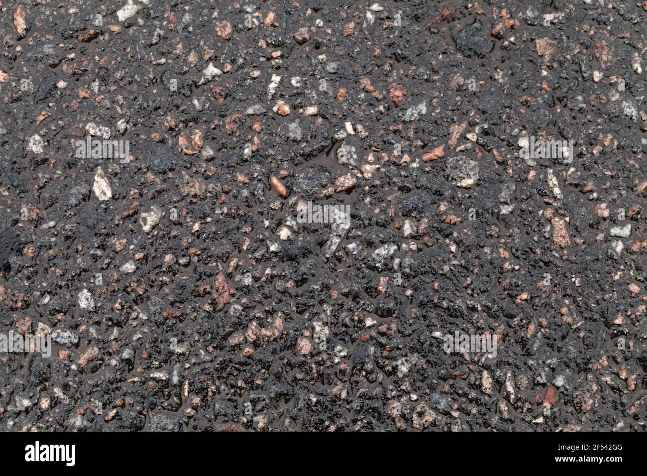 Wet road surface. Tarmac texture, dark road pavement consisting of ...