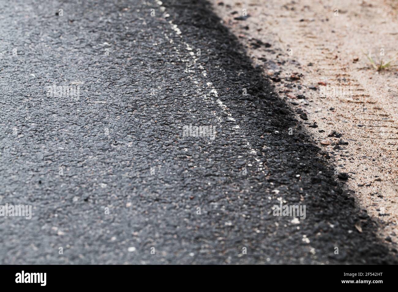 Asphalt road border and sandy roadside. Abstract transportation ...