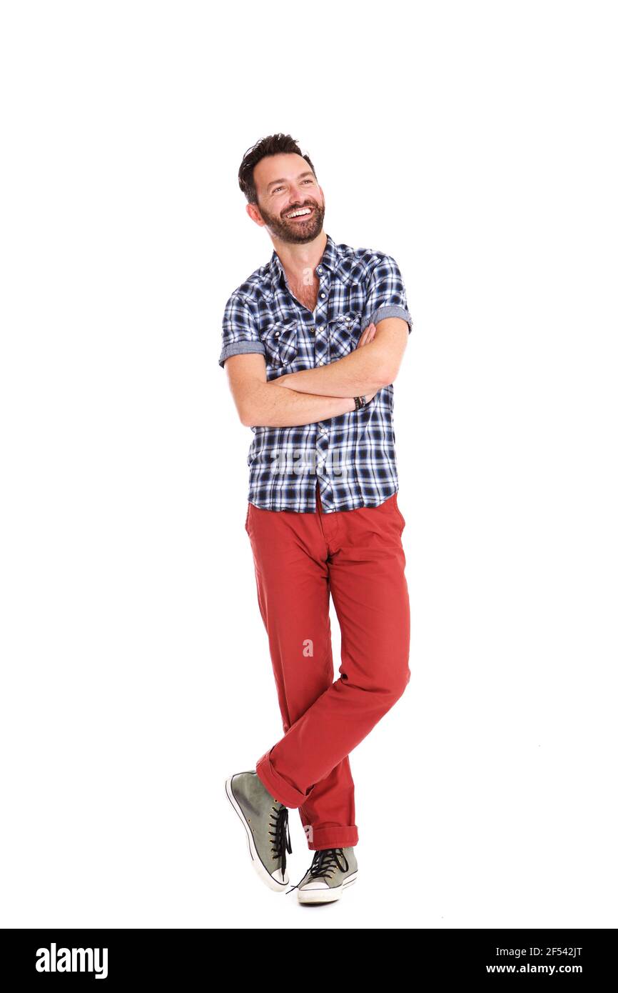 Full length portrait of handsome mature man standing relaxed over white ...