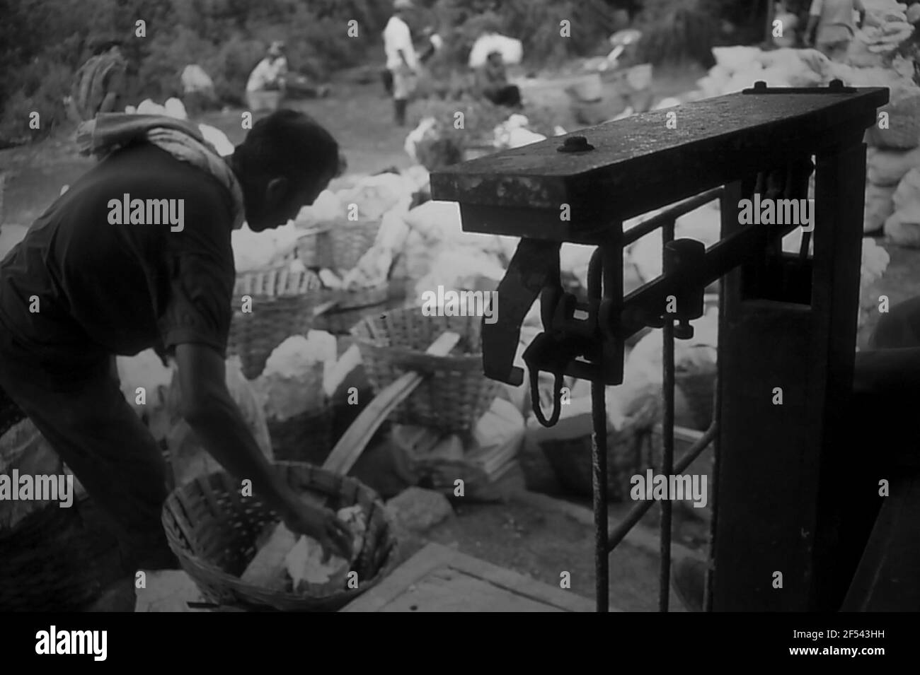 A sulfur miner packing his loads at the final check point of the sulfur ...