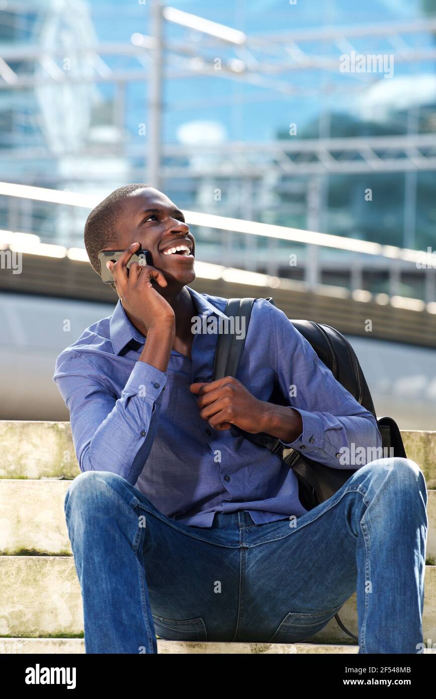 Portrait of happy african man talking on mobile phone and smiling Stock ...