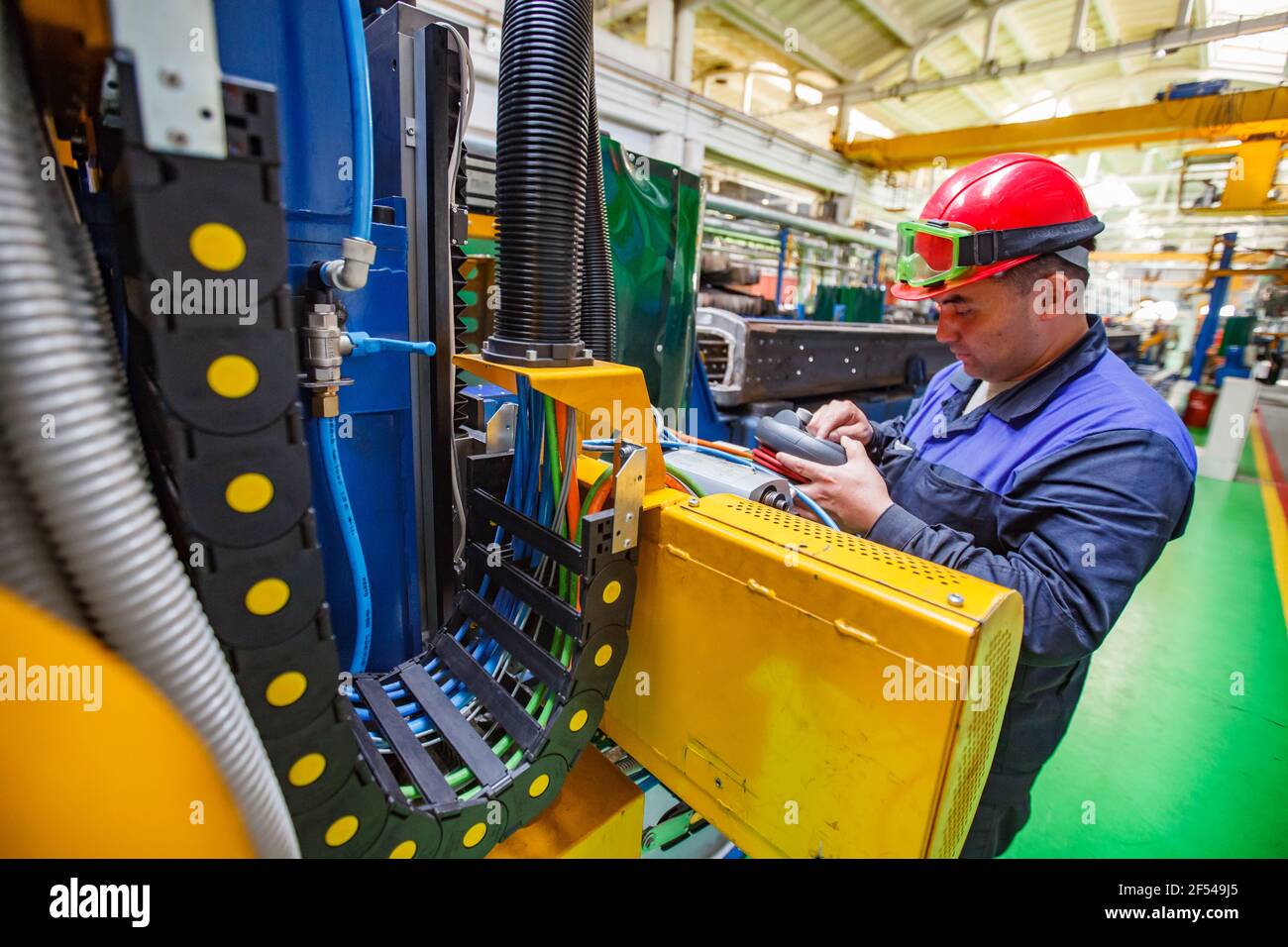 Ekibastuz, Kazakhstan: Rail car-building plant. Young Asian worker in ...