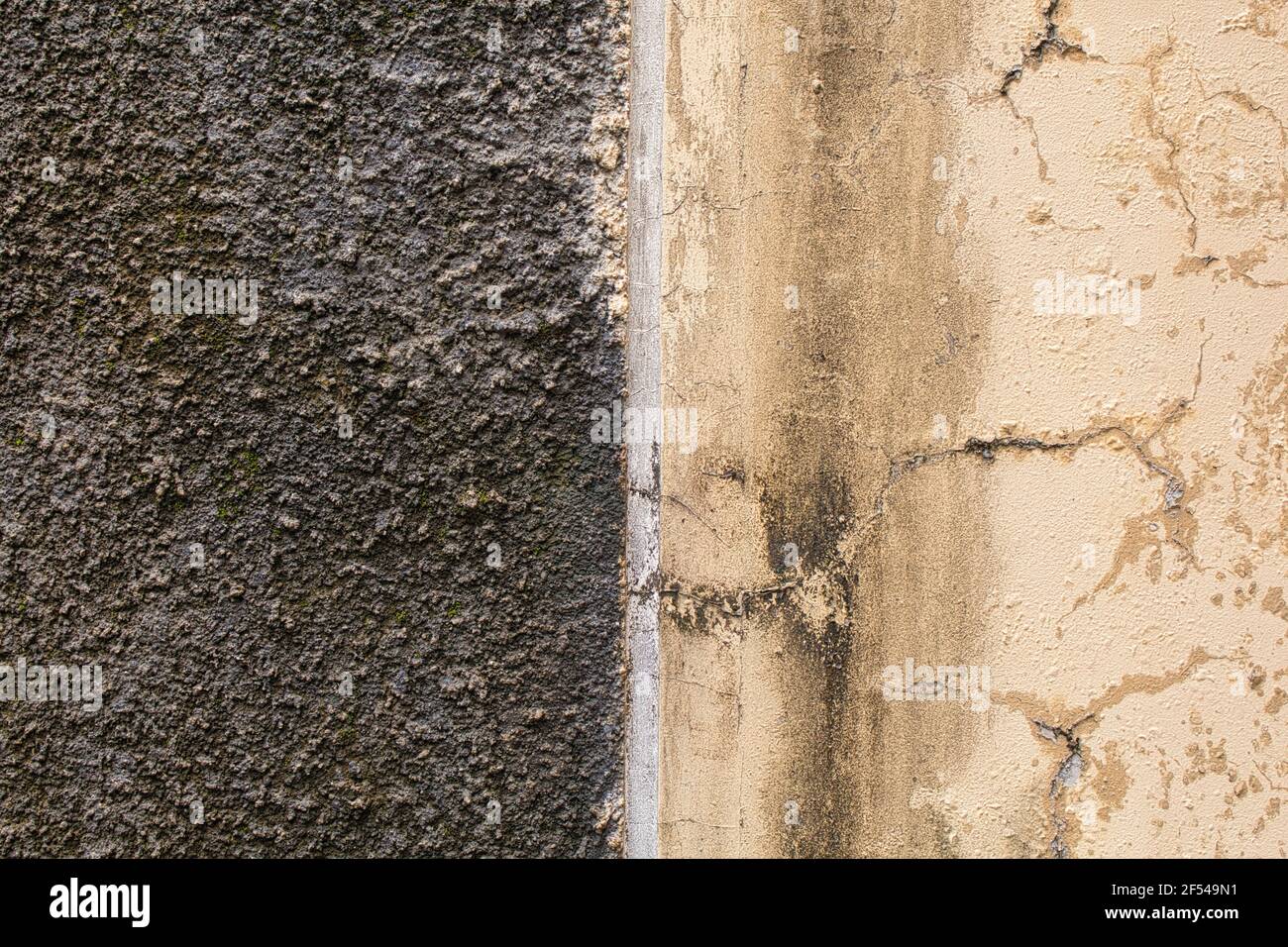 Rough wall texture of 2 sections: uneven dark gray and weathered beige ...