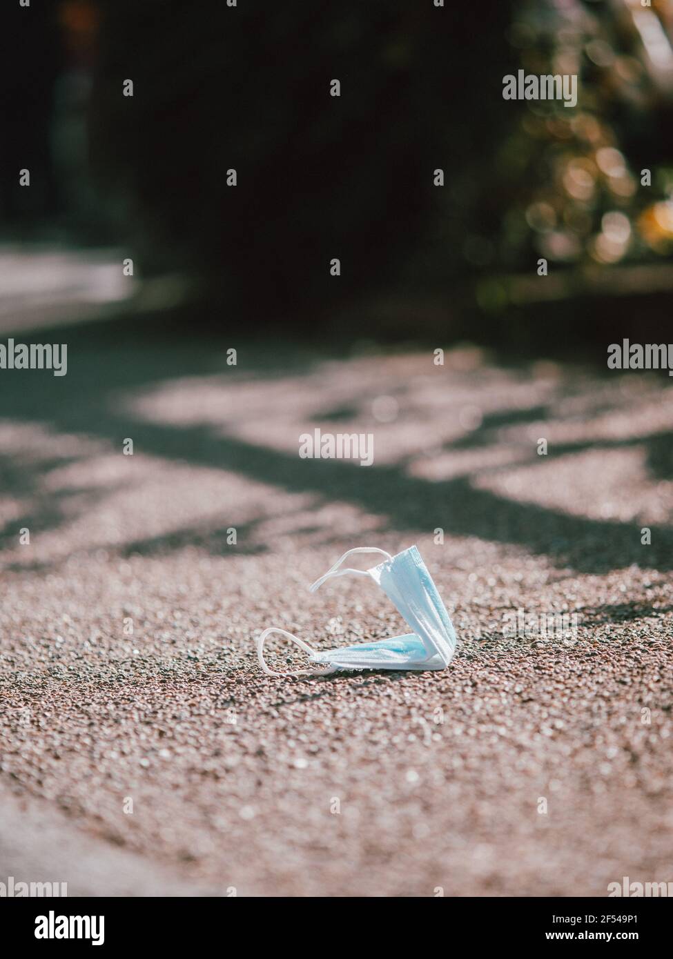 Face Mask Littered On The Floor Stock Photo - Alamy