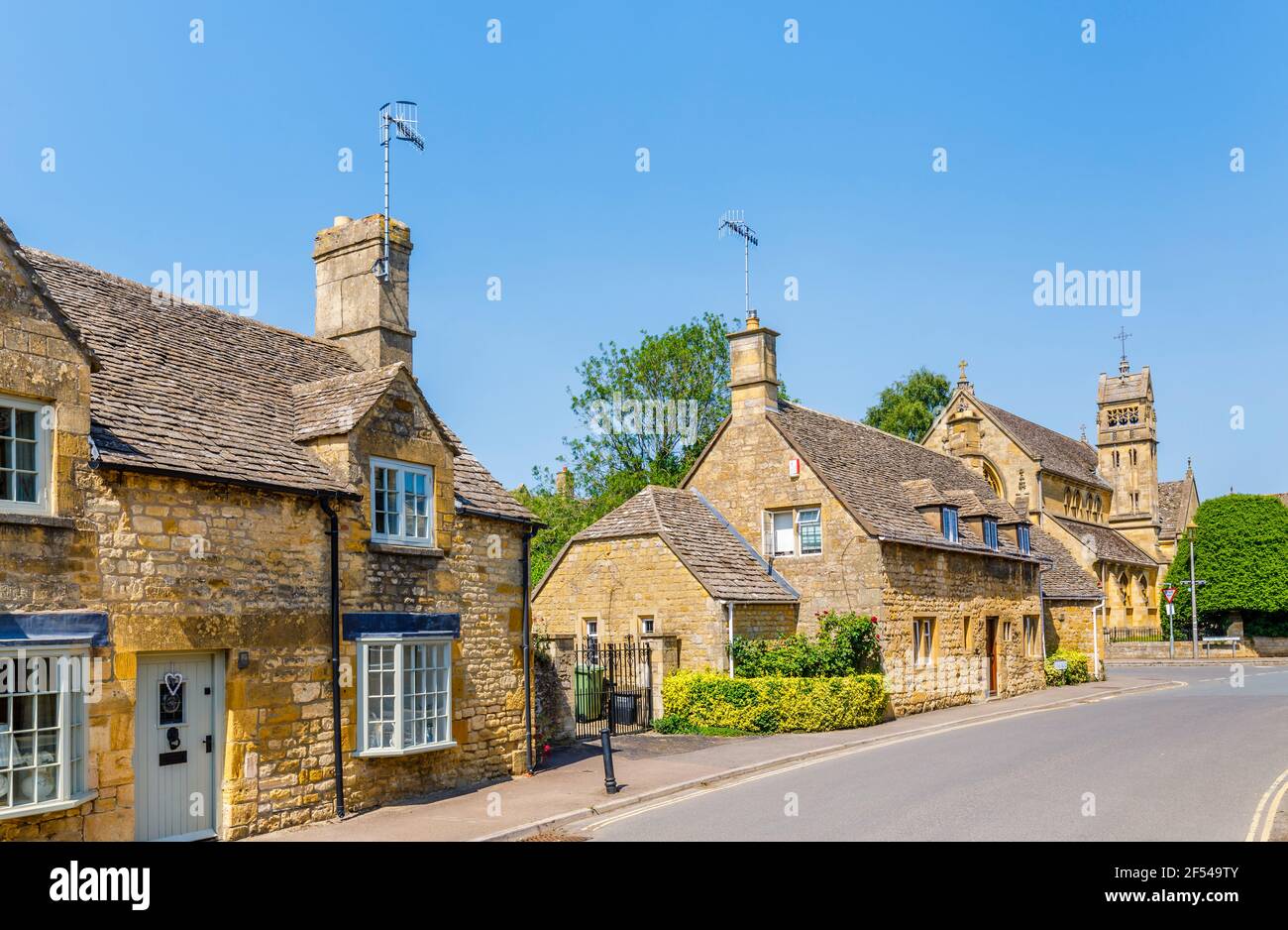 Typical roadside Cotswold stone slate roof houses and St Catharine's ...
