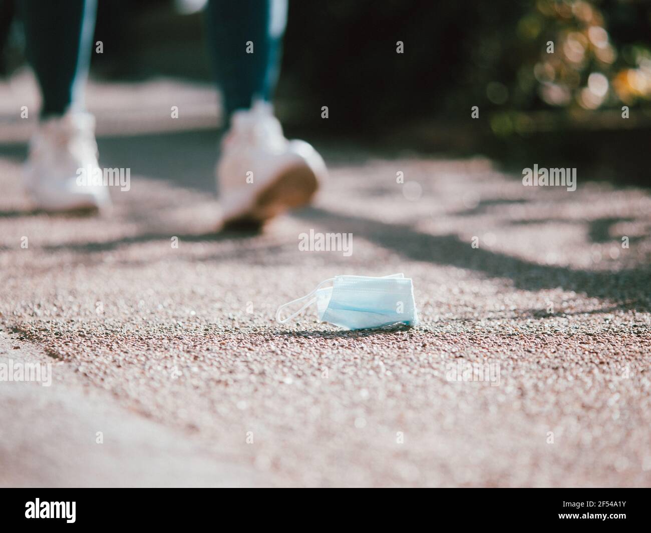 Face Mask Littered On The Floor Stock Photo - Alamy