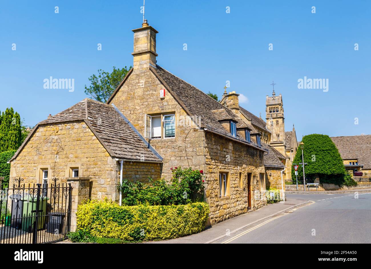 Typical roadside Cotswold stone slate roof houses and St Catharine's ...