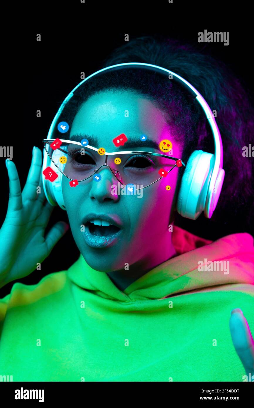 Tears illustrated of social media activity signs on female face in neon ...