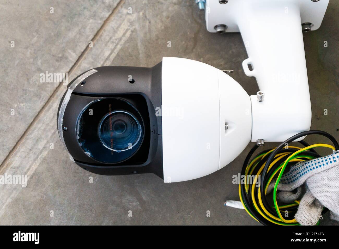 a rotary video camera for street surveillance lies on the ground ready ...