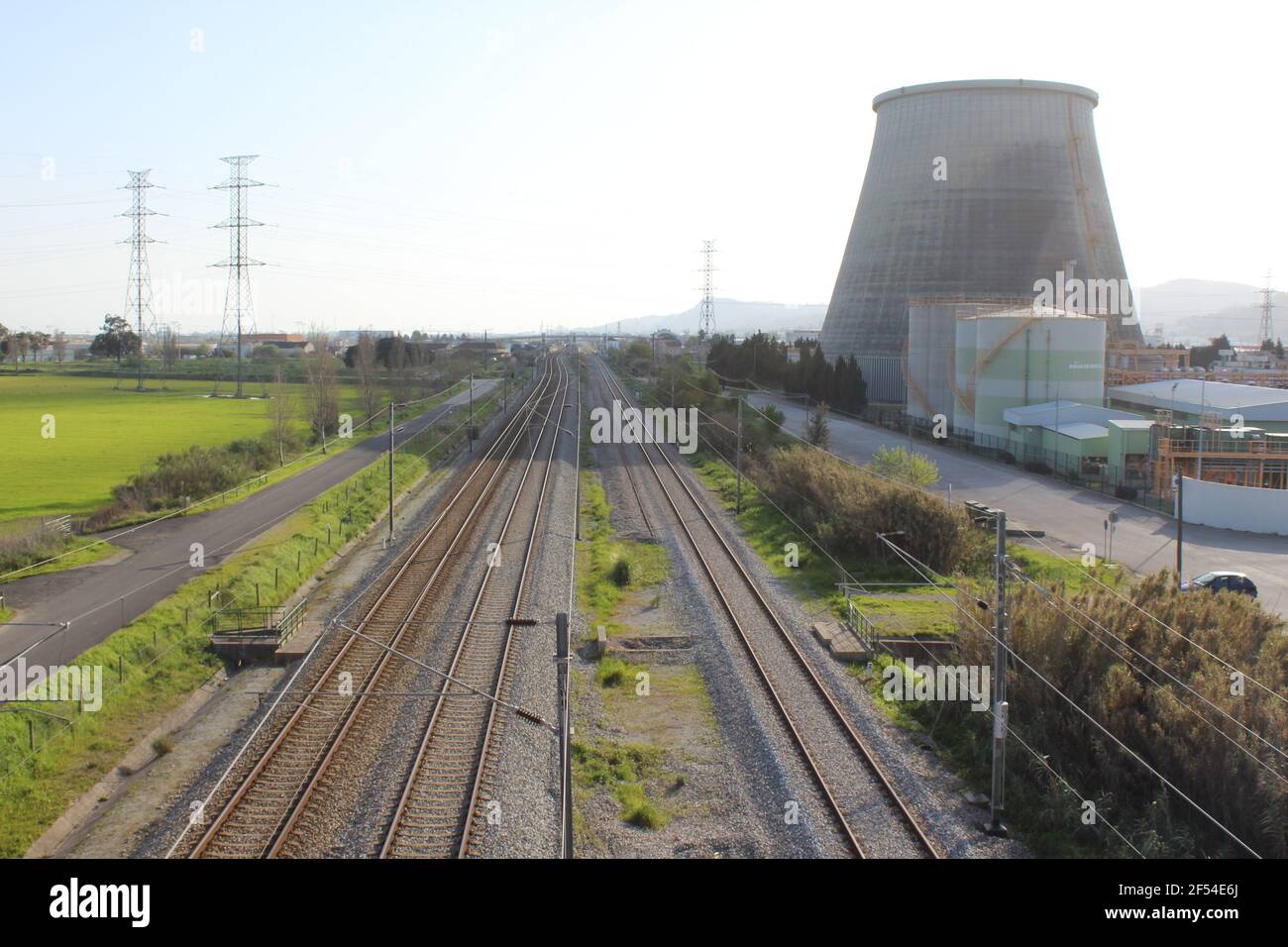 landscape of railroad ,train line between fields and thermoelectric ...
