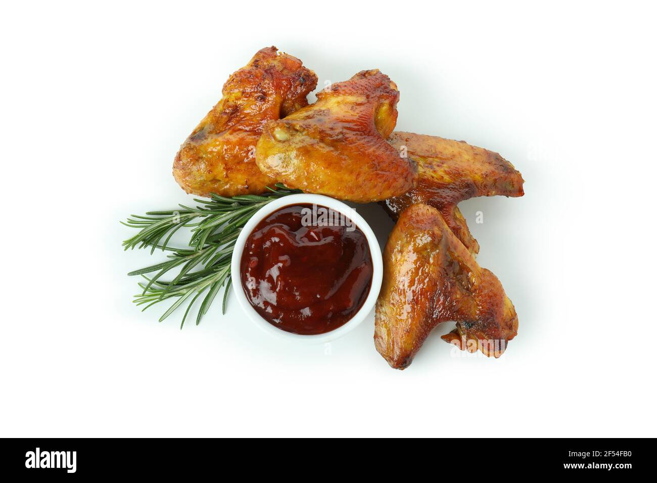 Baked chicken wings with rosemary and sauce isolated on white ...