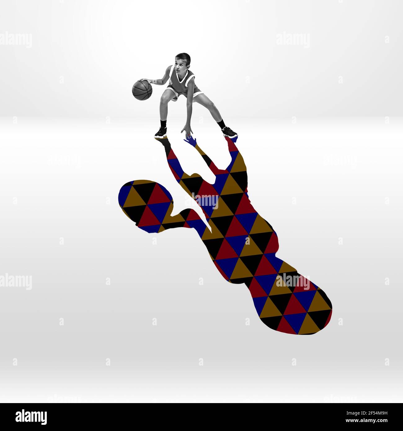 Young caucasian sportsman isolated on studio background with shadow ...