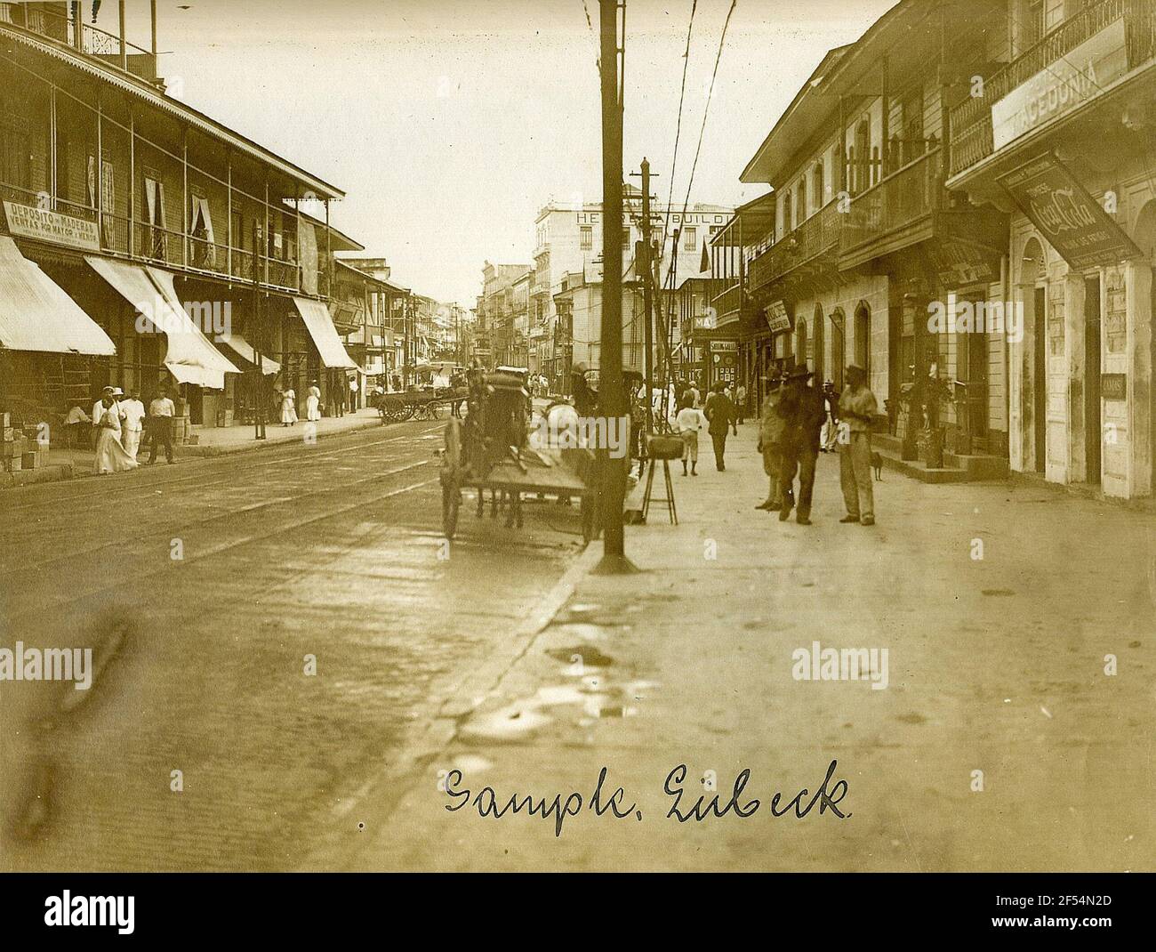 Panama city. Street scene of a business street with locals and horse ...