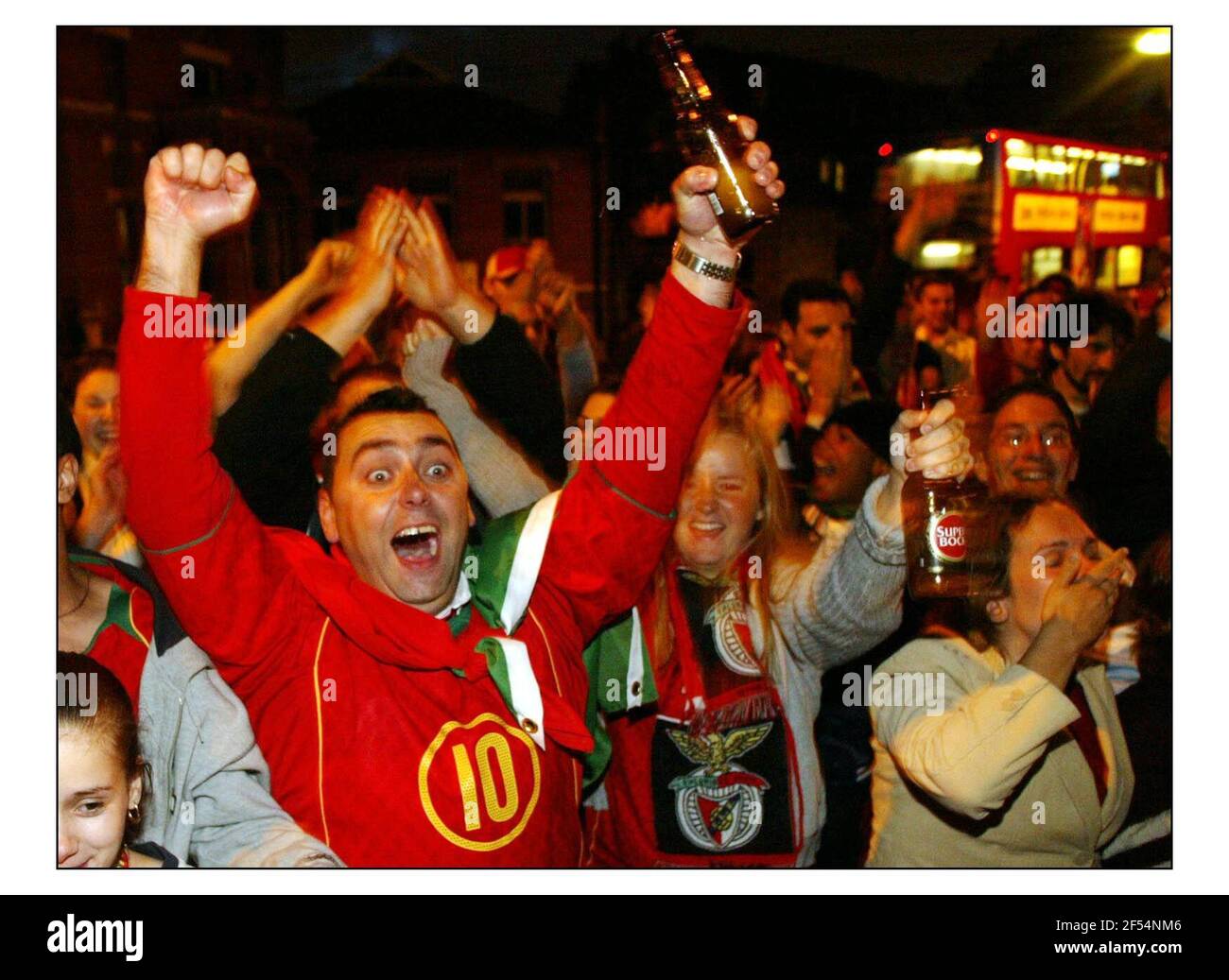 Portugese fans celebrate their win against England in Euro 2004 outside ...