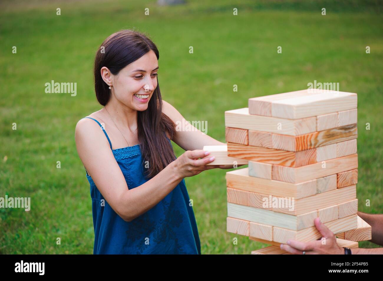 Giant Outdoor Block Game game on the green grass Stock Photo - Alamy
